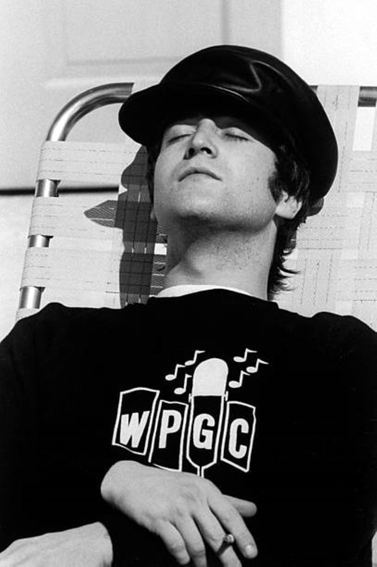 Photos - John Lennon, of The Beatles, relaxing on a poolside lounge ...